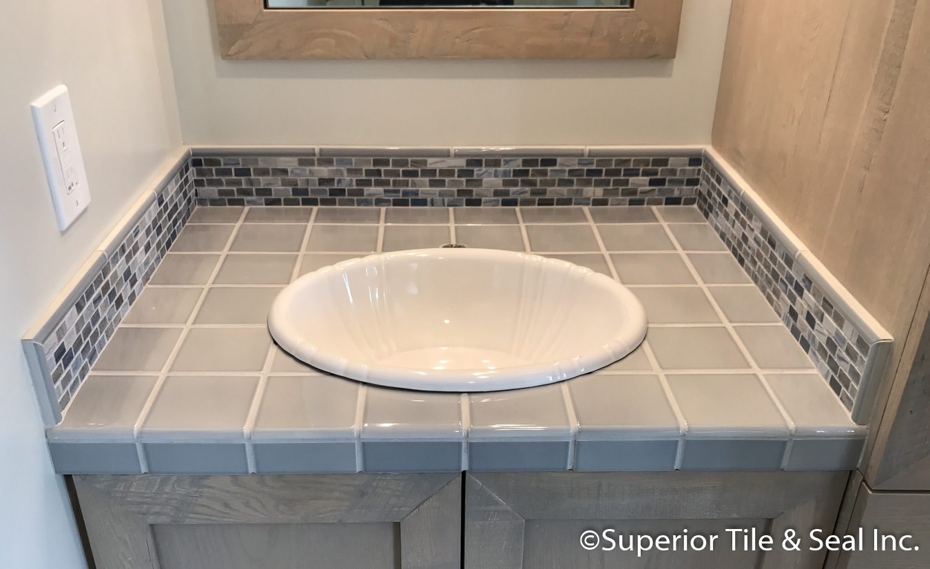 Ceramic Tile Couter top with Limerstone Mosaic Tile Splash and Glass ...